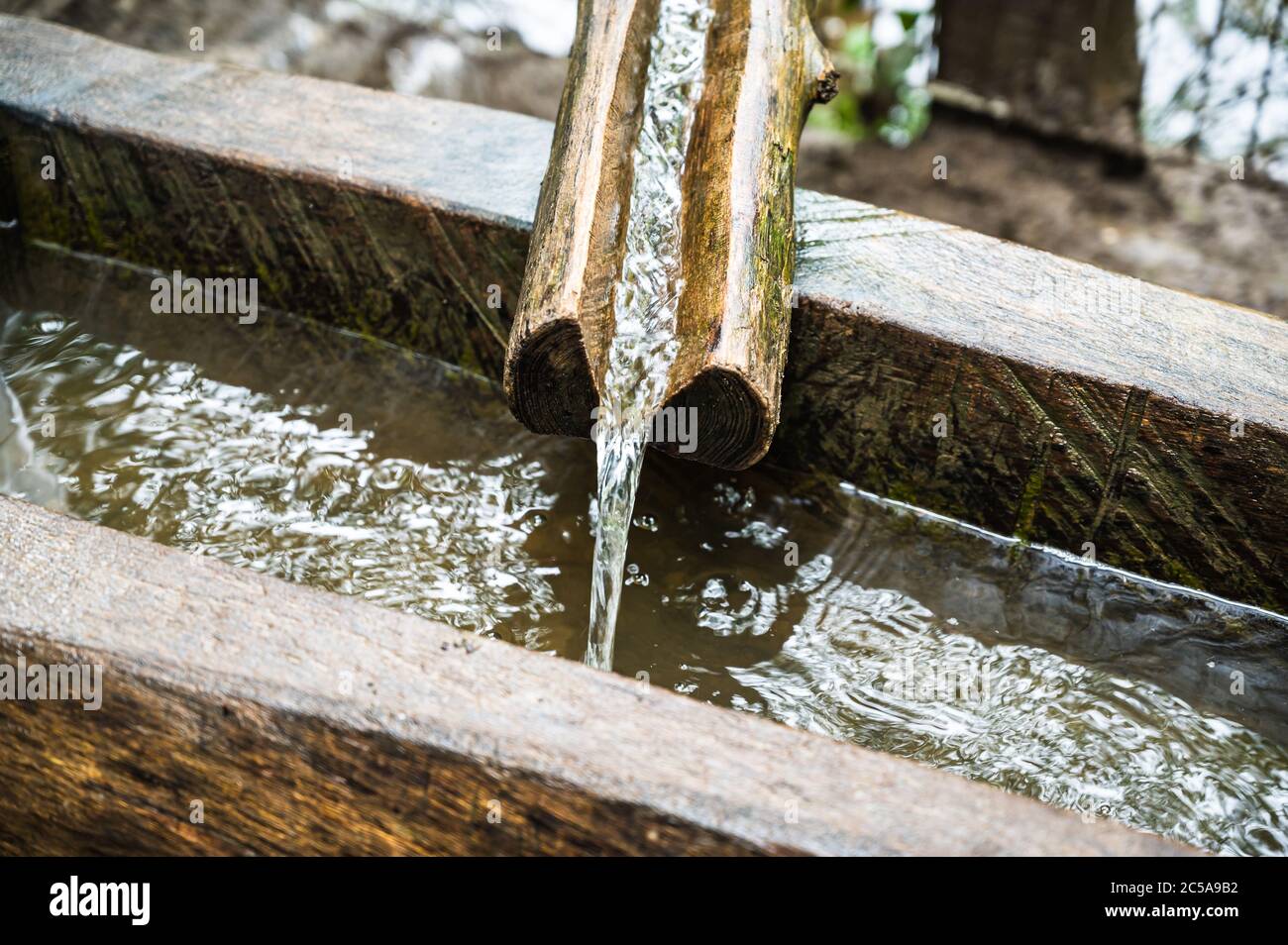 Closeup shop of clean, fresh, natural spring of drinking water falling ...