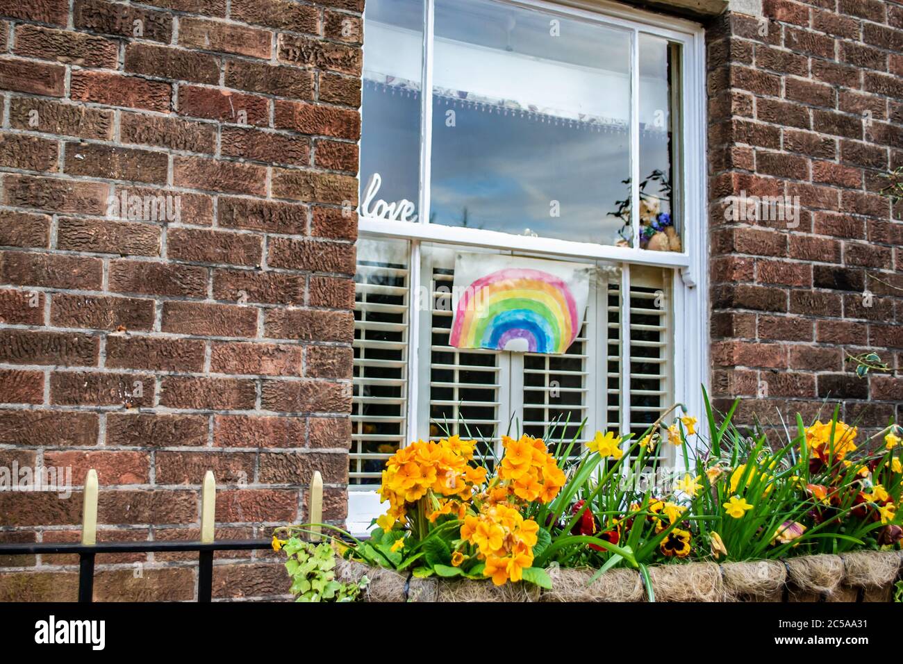 Rainbow drawing in a window- as a sign of hope during the 2020 ...
