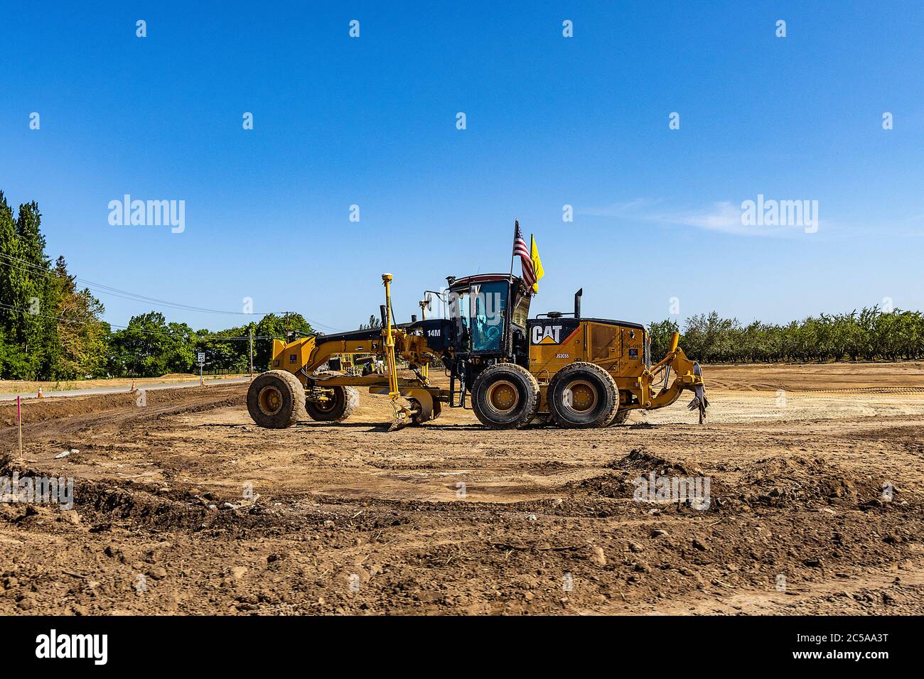 A Caterpillar model 14M grader on the job at the re-routing of Highway ...