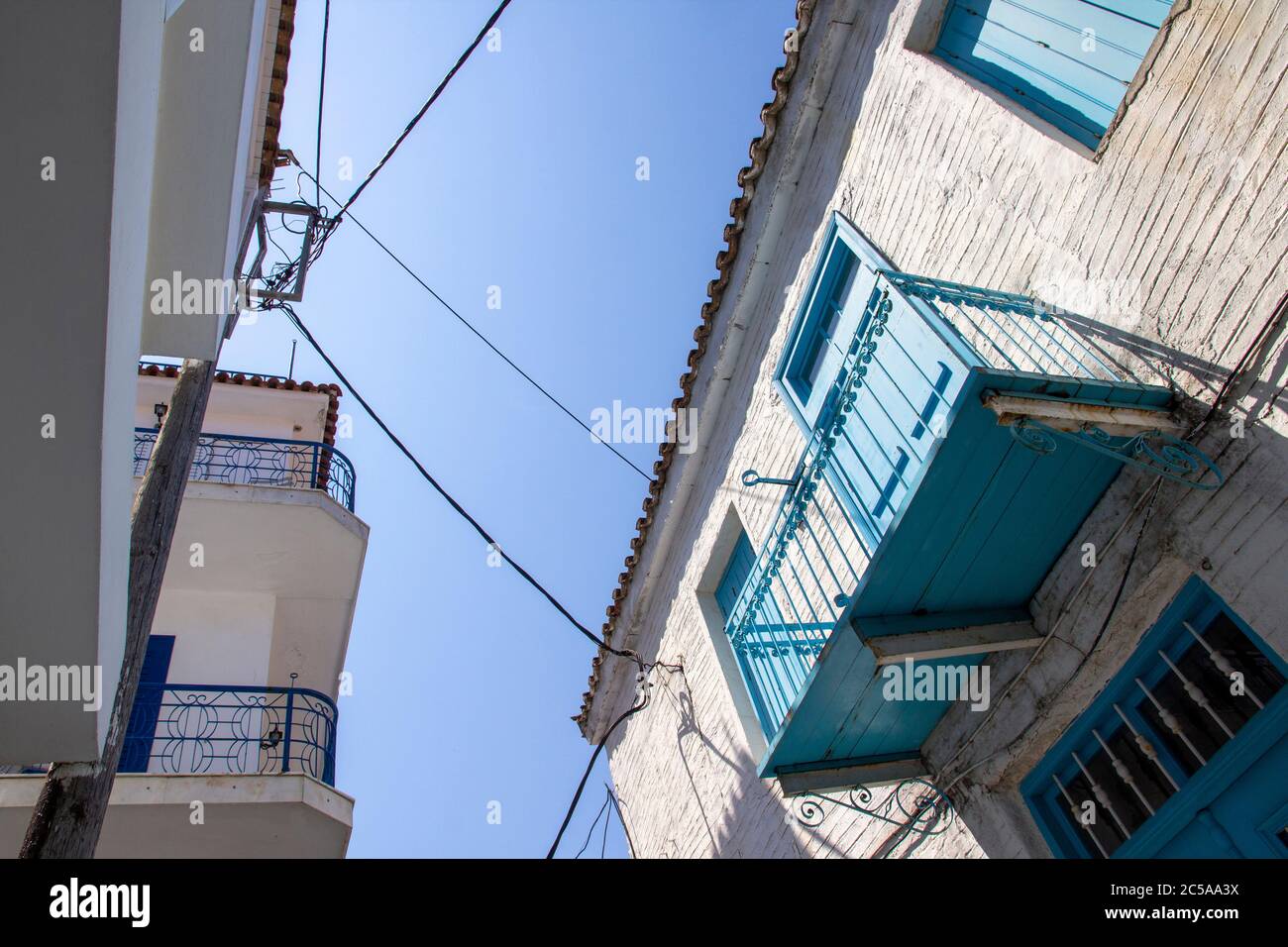 SKIATHOS, GREECE - AUGUST 13, 2019. Looking up at balcony on ...