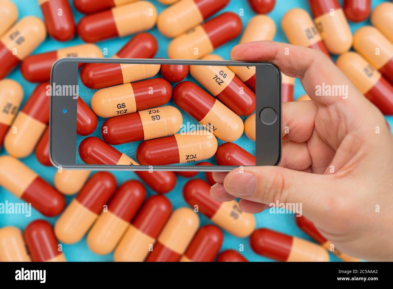 Medicine pills or capsules on smartphone screen. Medicinal prescription ...