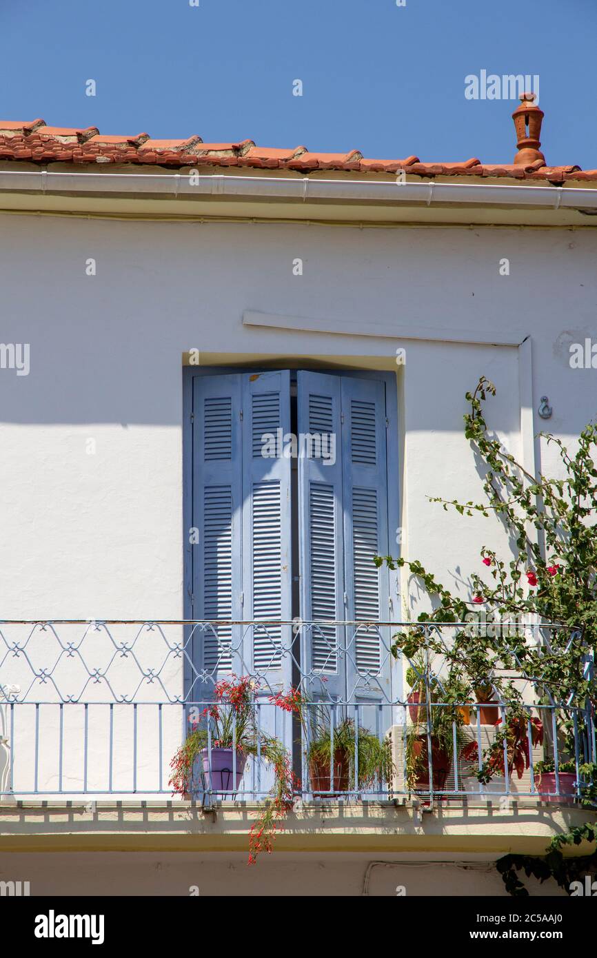 SKIATHOS, GREECE - AUGUST 13, 2019. Looking up at balcony on ...