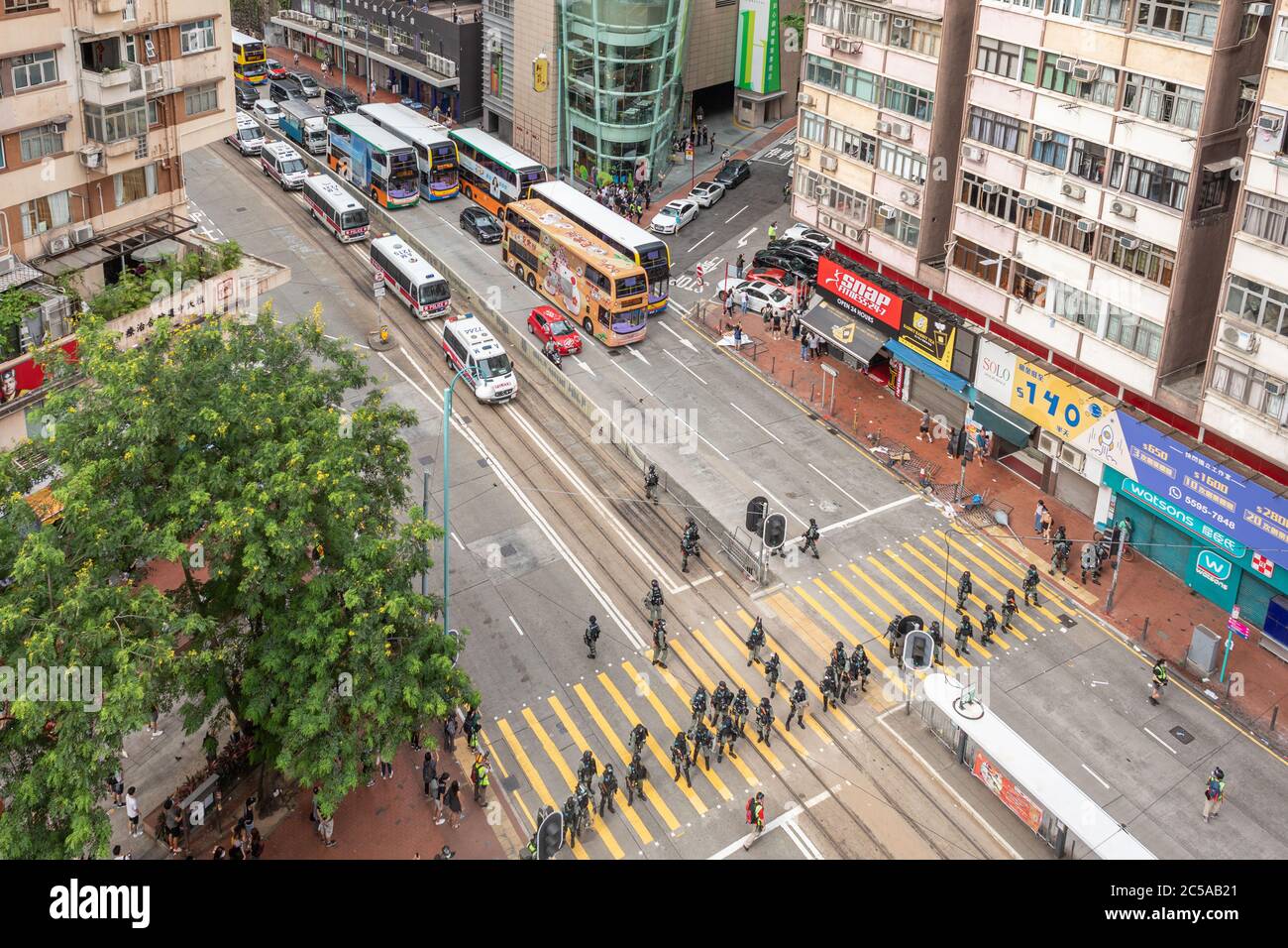Police officers set up a cordon line to stop traffic to enter the ...