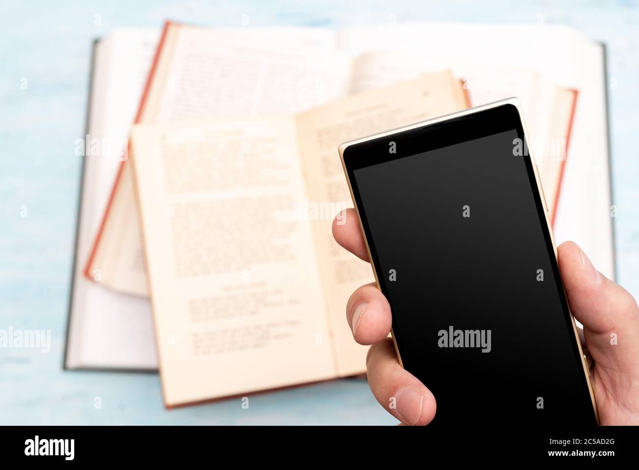 Smartphone in mans hand. Modern gadget phone. Phone screen. Old paper ...