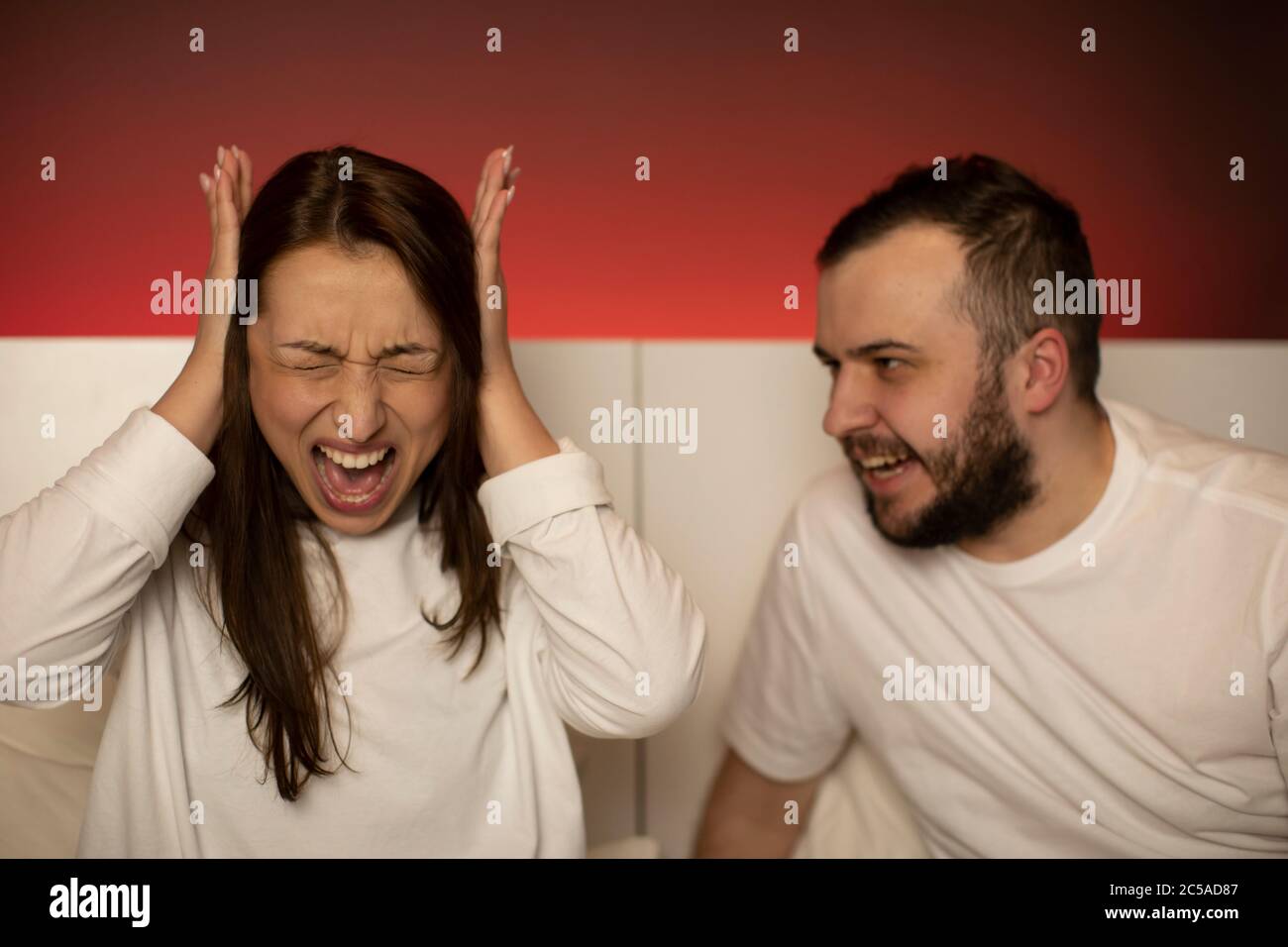 Angry Husband Yells At Wife During Quarrel Crying Woman Holds Head With