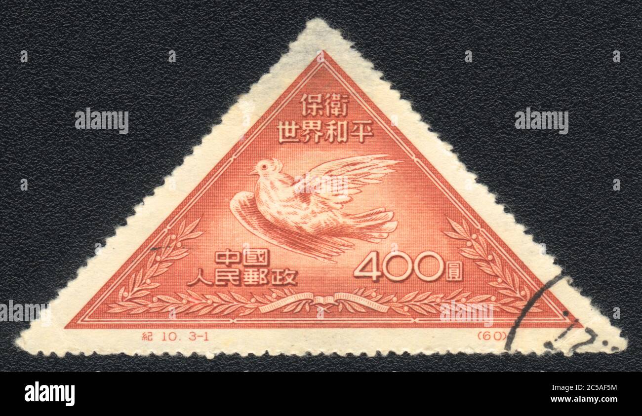 Triangular postage stamp Dove of peace, China 1951 Stock Photo - Alamy