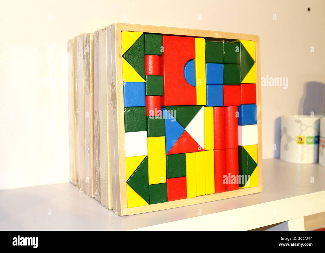 Wooden building block set in multi color Stock Photo - Alamy