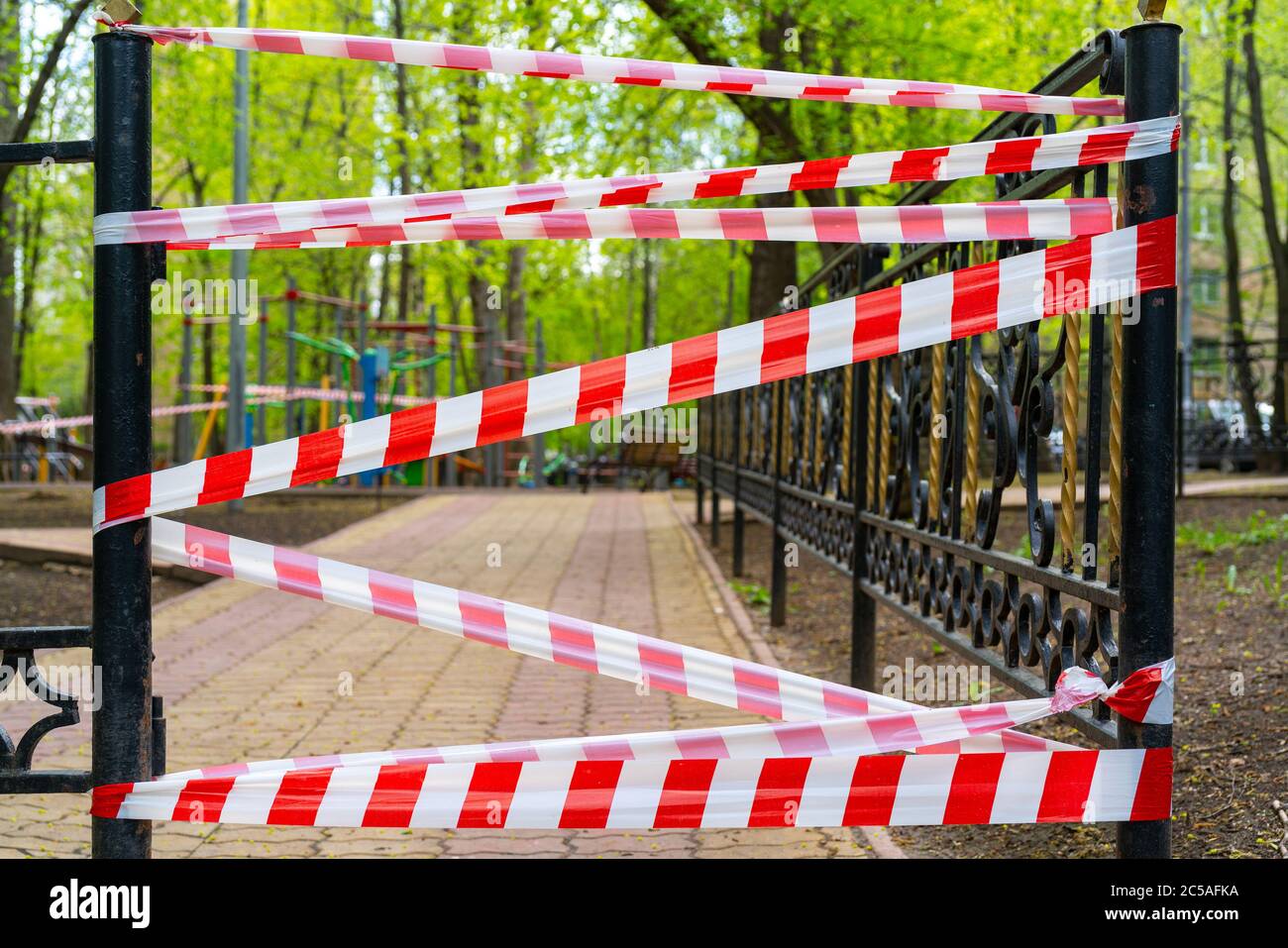 Ban on entry to park. Banning tape blocks entry. Quarantine ...