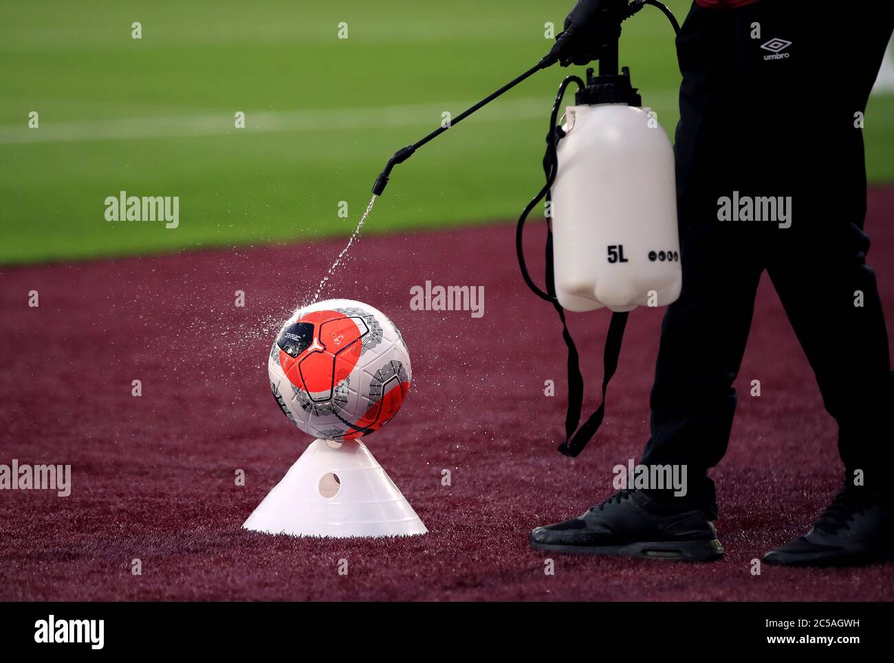 Disinfecting a match ball on a cone during the Premier League match at ...