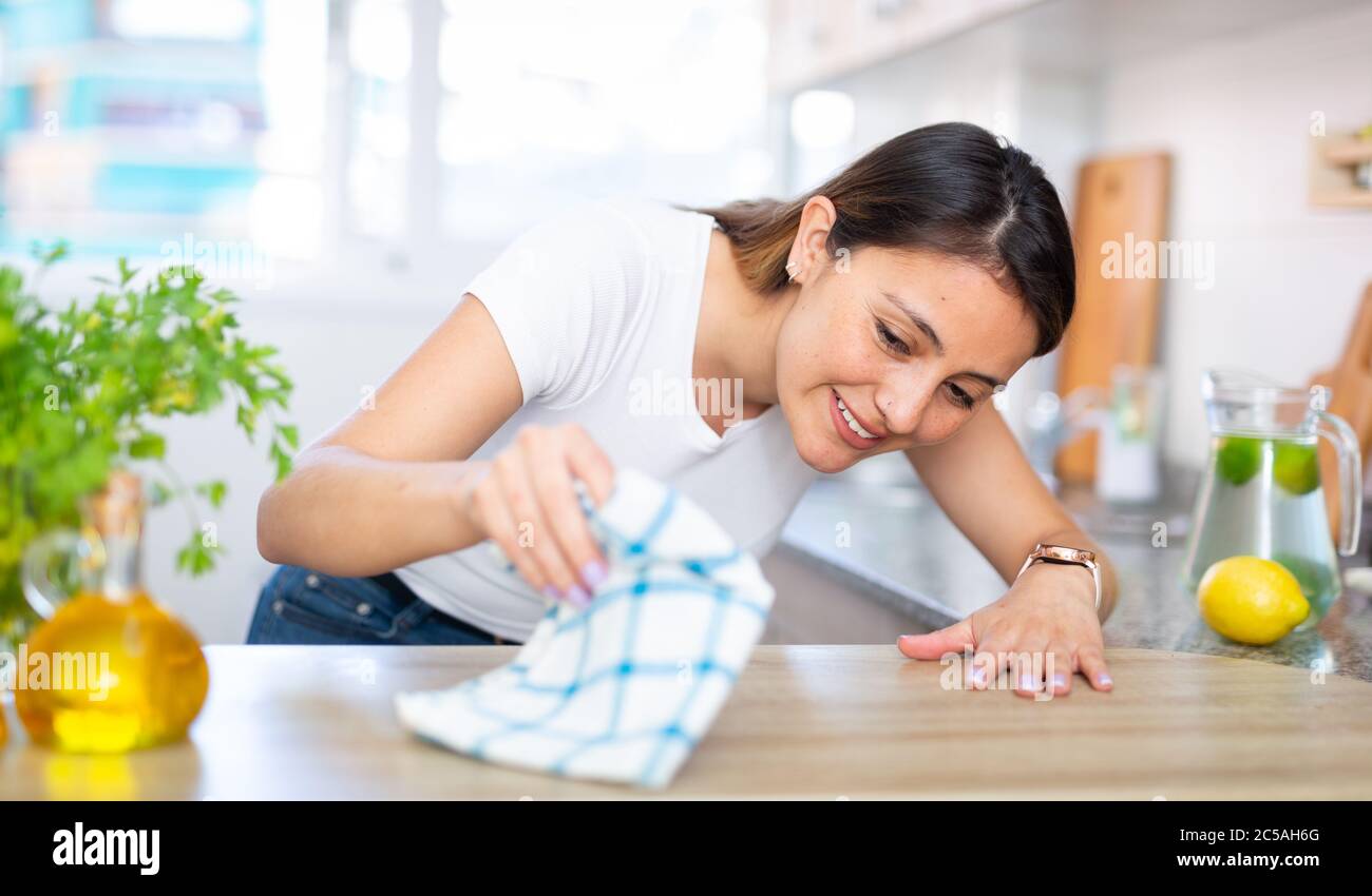 Female is caring about clean of kitchen at her house Stock Photo - Alamy