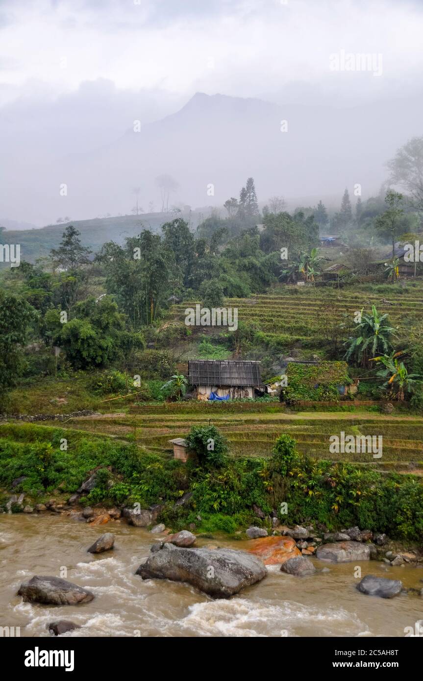 Cloudy landscape of Sapa, Vietnam. The mountains disappear in the fog ...