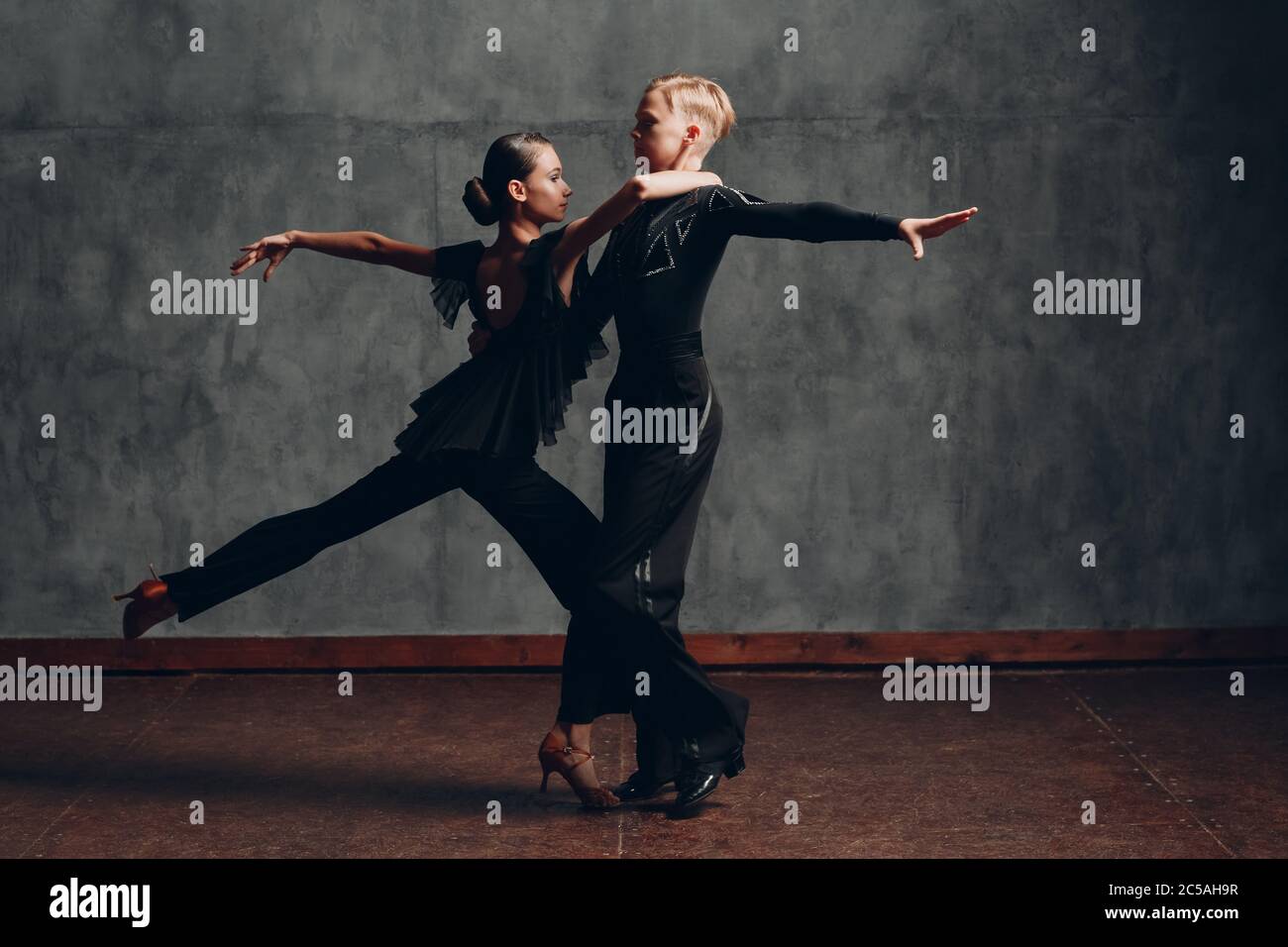 Couple in black dress dancing ballroom dance rumba Stock Photo - Alamy