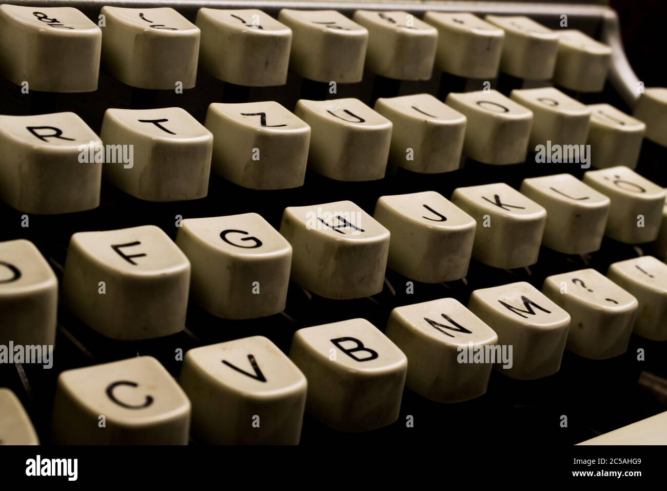 Macro closeup of isolated keys of old typewriter with letters and ...