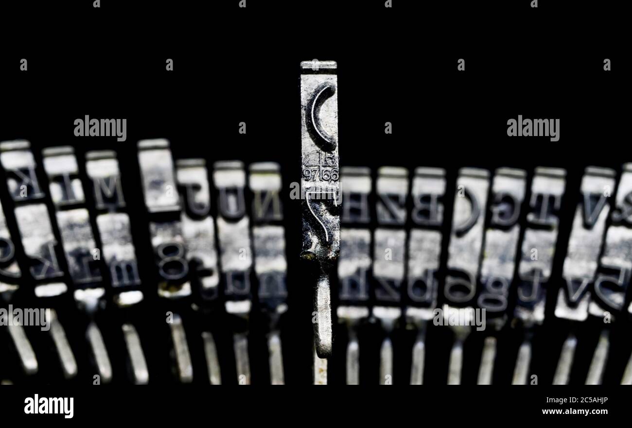 Macro closeup of isolated type bars of old typewriter with letters and ...