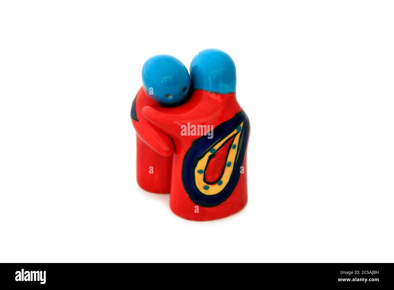 Matching ceramic figures hugging salt & pepper pots Stock Photo - Alamy