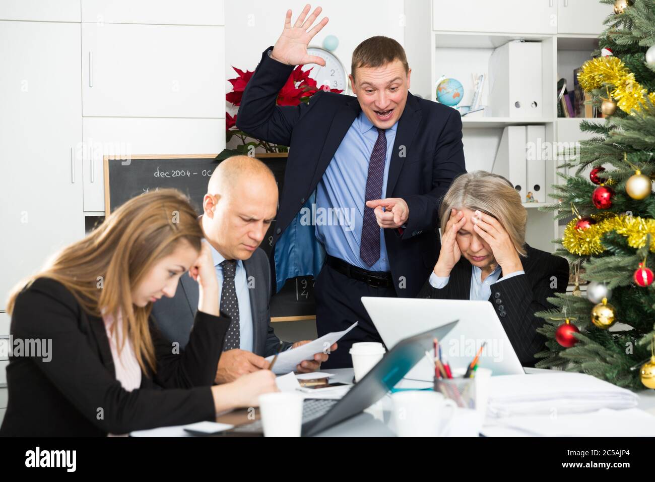 Outraged businessman expressing dissatisfaction with work of frustrated ...