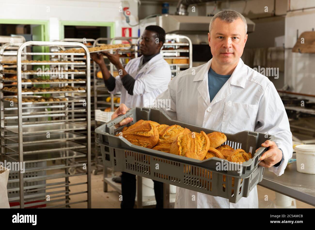 Carrying freshly baked loaves hi-res stock photography and images - Alamy