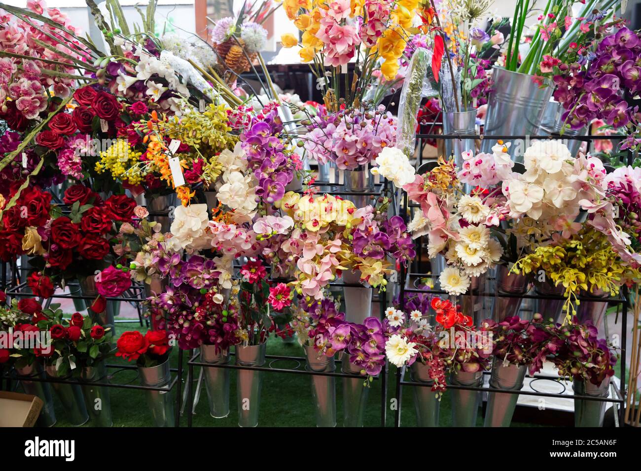 artificial flowers prepared for sale on display in shop Stock Photo - Alamy