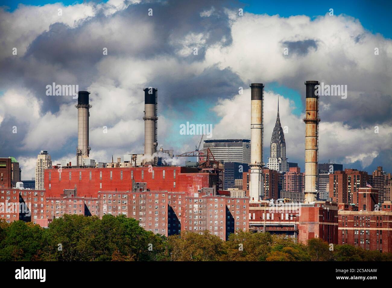 Factory pipes on a sky background, New York City Stock Photo - Alamy