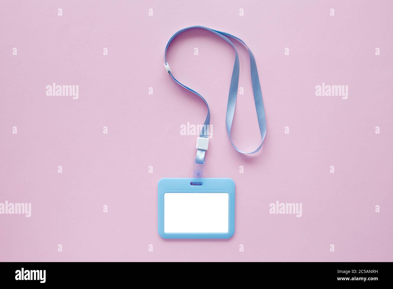 Blank badge mockup on pink background. Tag id pass, plastic ...