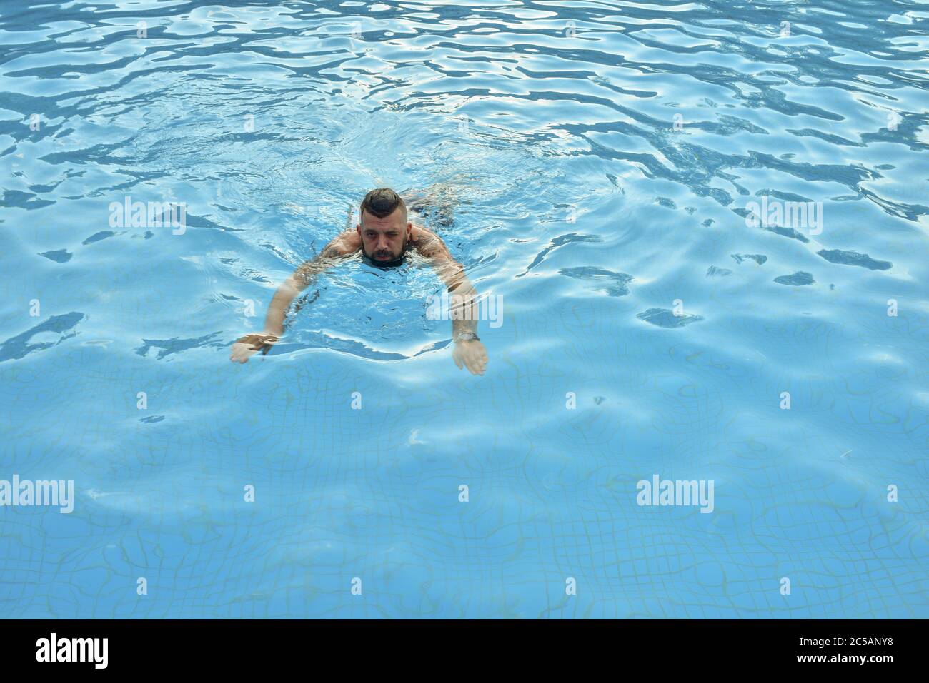 Bearded man swimming in a pool. Man with a beard in the pool Stock ...
