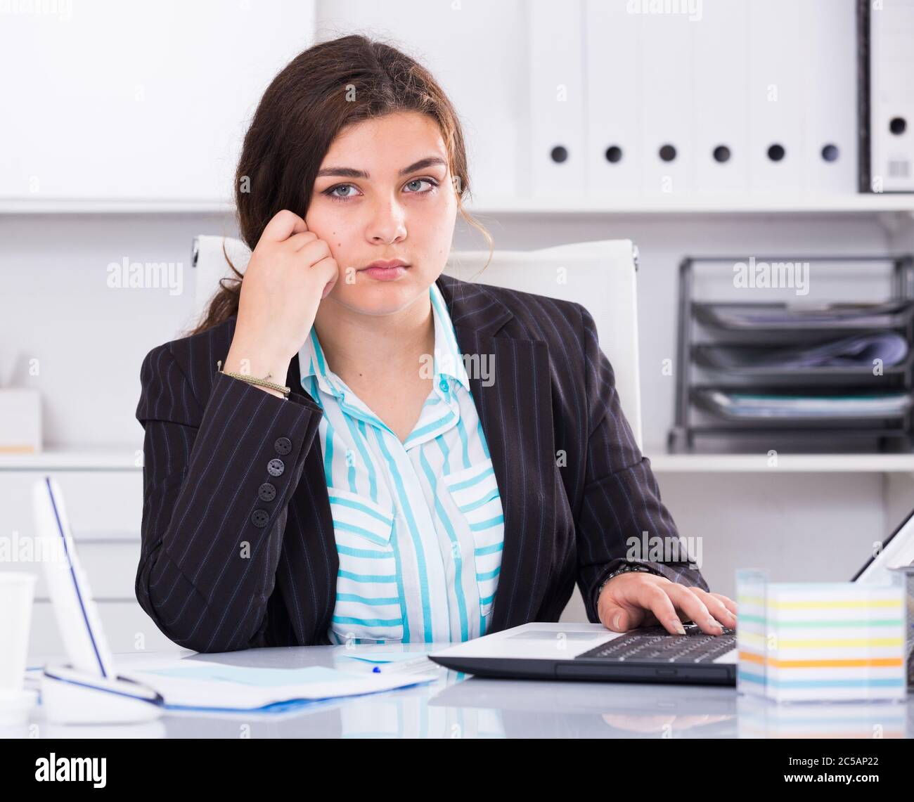 Office worker woman is having complicated issue with project in office ...