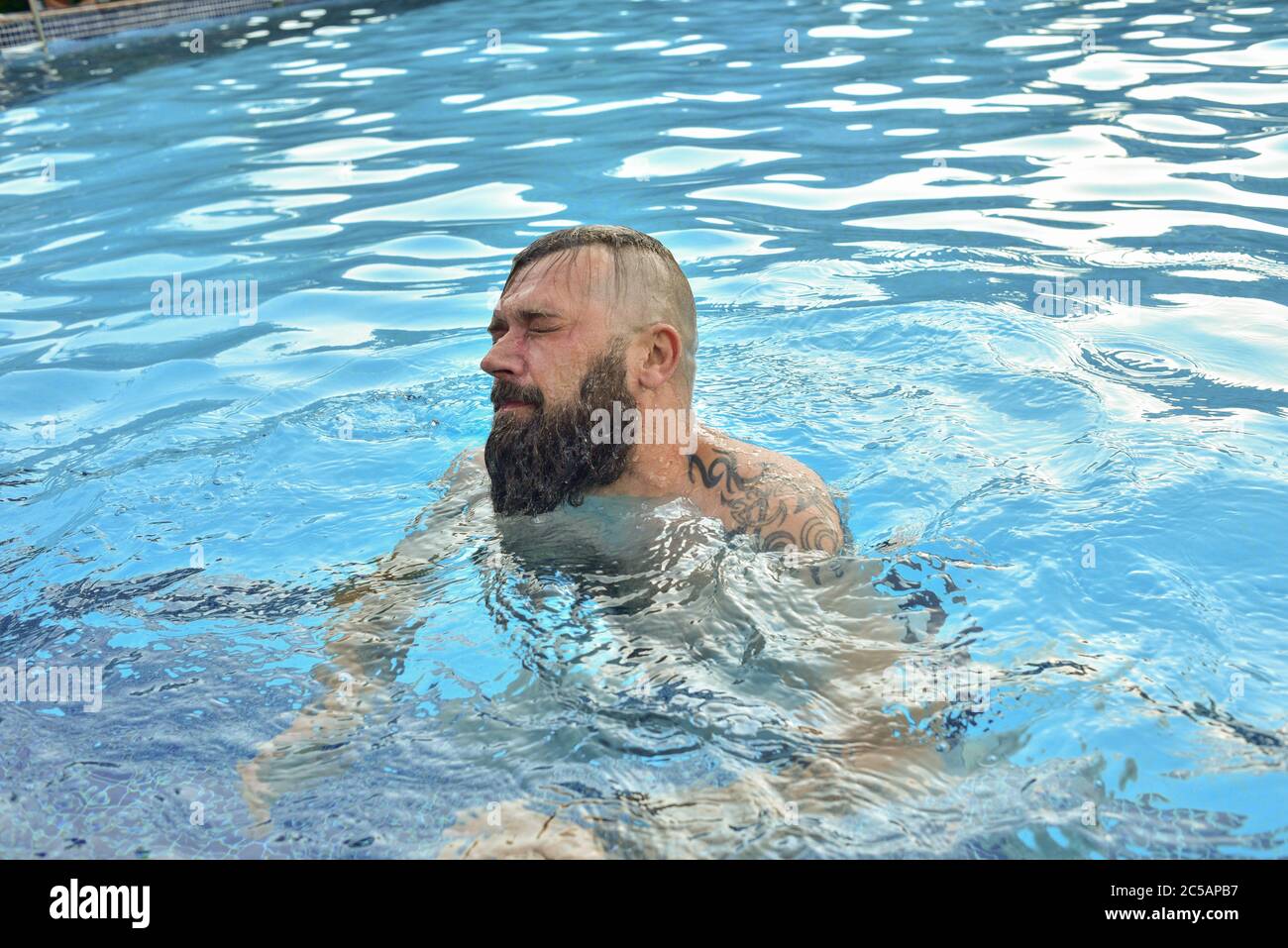 Bearded man swimming in a pool. Man with a beard in the pool Stock ...