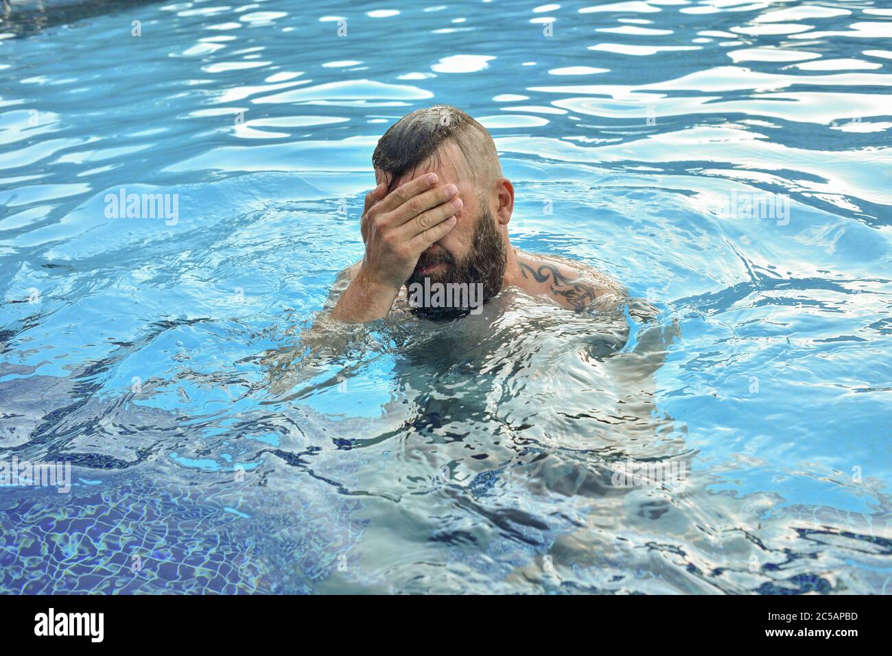 Bearded man swimming in a pool. Man with a beard in the pool Stock ...
