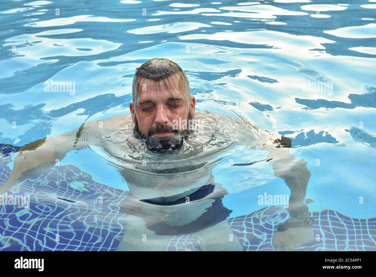 Bearded man swimming in a pool. Man with a beard in the pool Stock ...
