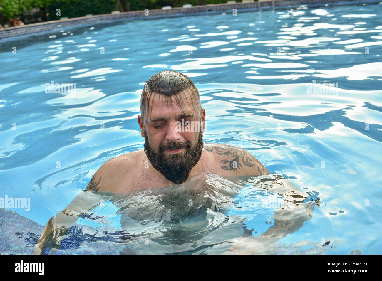 Bearded man swimming in a pool. Man with a beard in the pool Stock ...