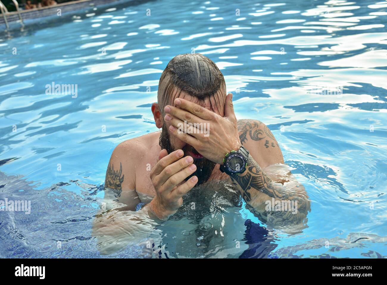 Bearded man swimming in a pool. Man with a beard in the pool Stock ...