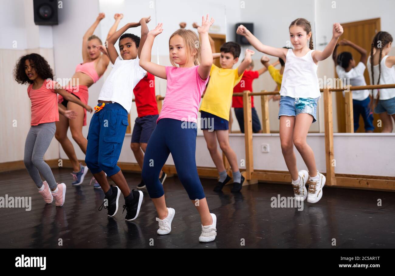 Group of children training in class, learning dance movements Stock ...