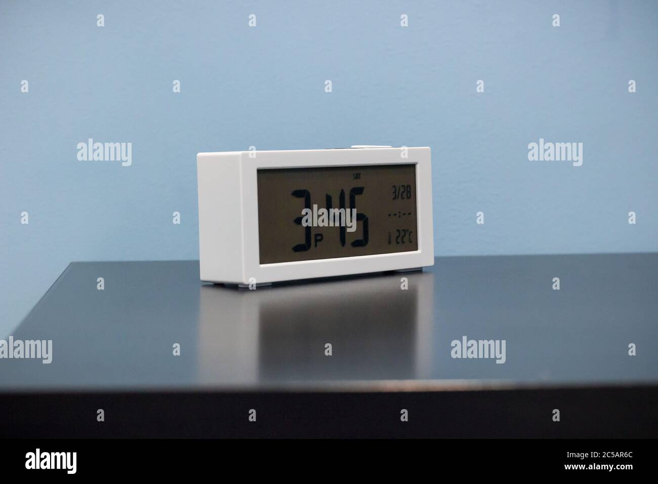Selective focus shot of a digital clock showing the time on a table by ...
