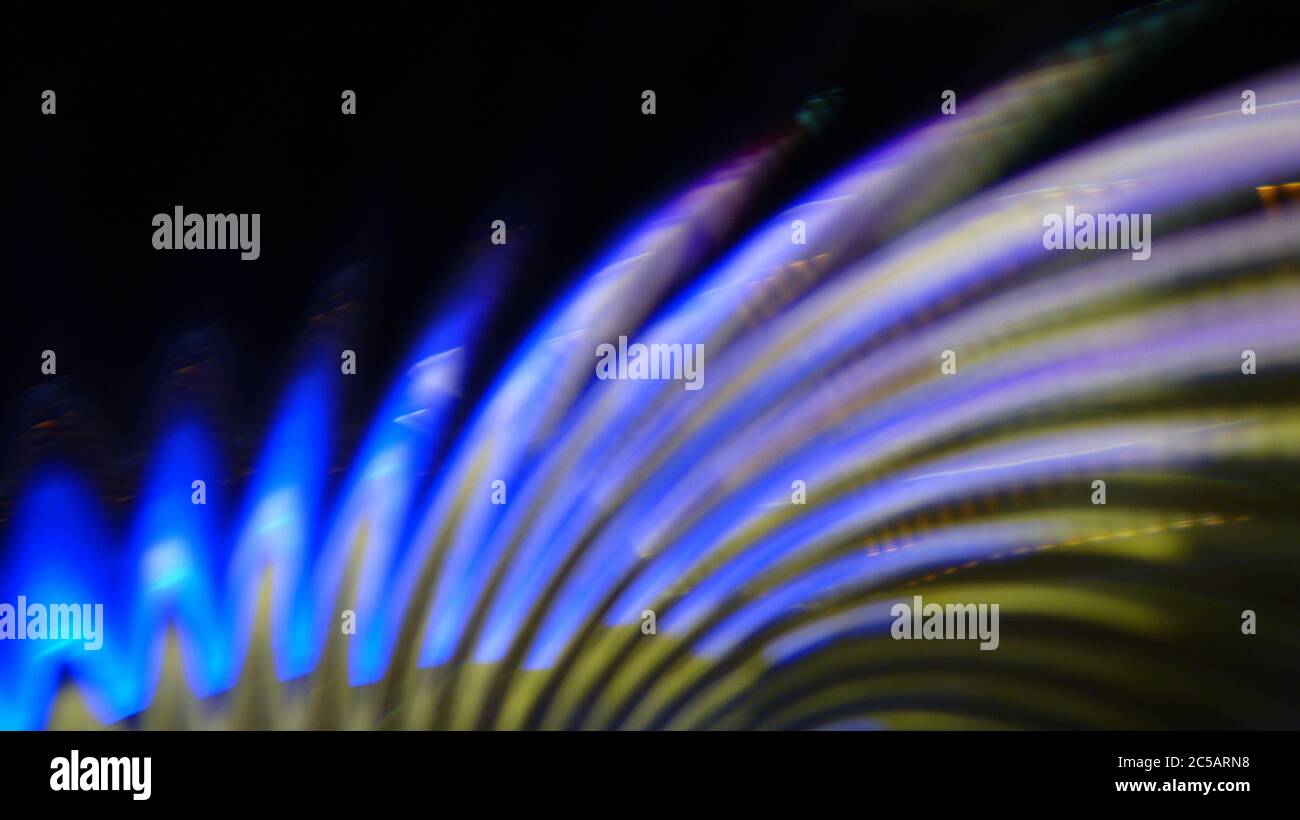 Beautiful shot of staggered and refracted colorful light layers on dark ...