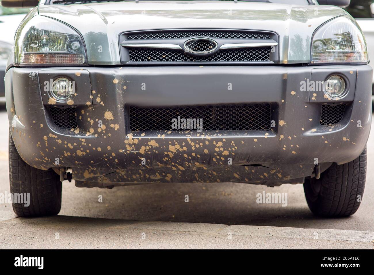 dirty car front view on an SUV with mud-stained bumper, close up Stock ...
