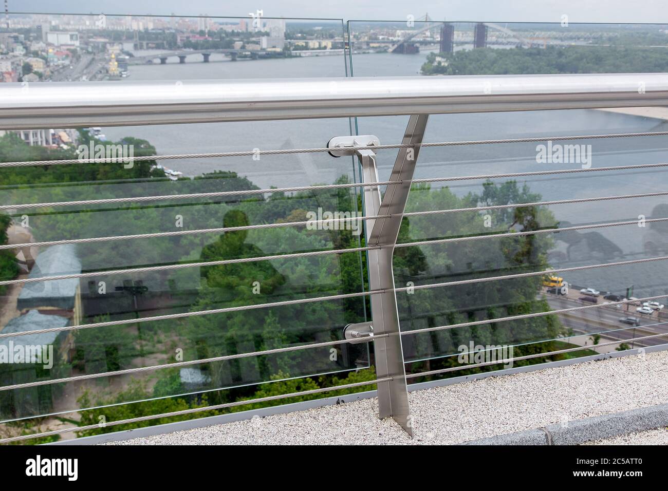construction details of a glass bridge with steel fixtures with a ...