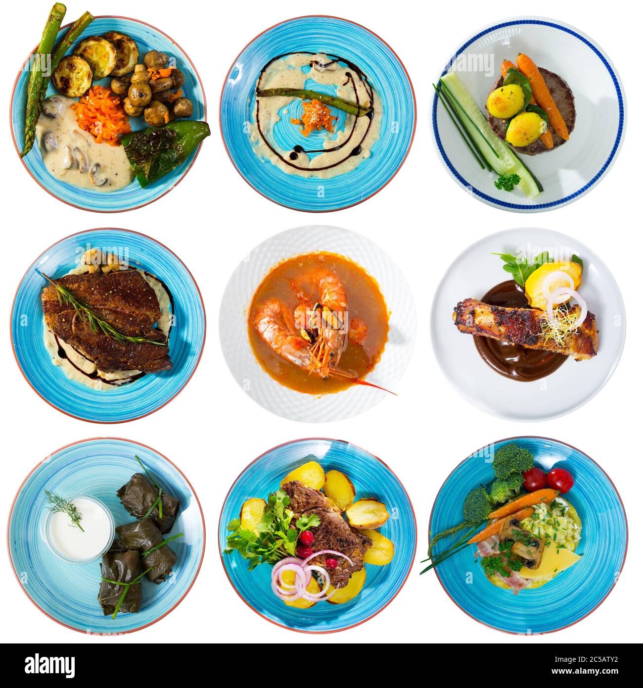 Collection of various dishes on round plates on white background Stock ...