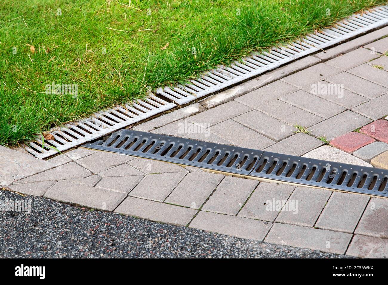 the intersection of the asphalt road and the pedestrian sidewalk made ...