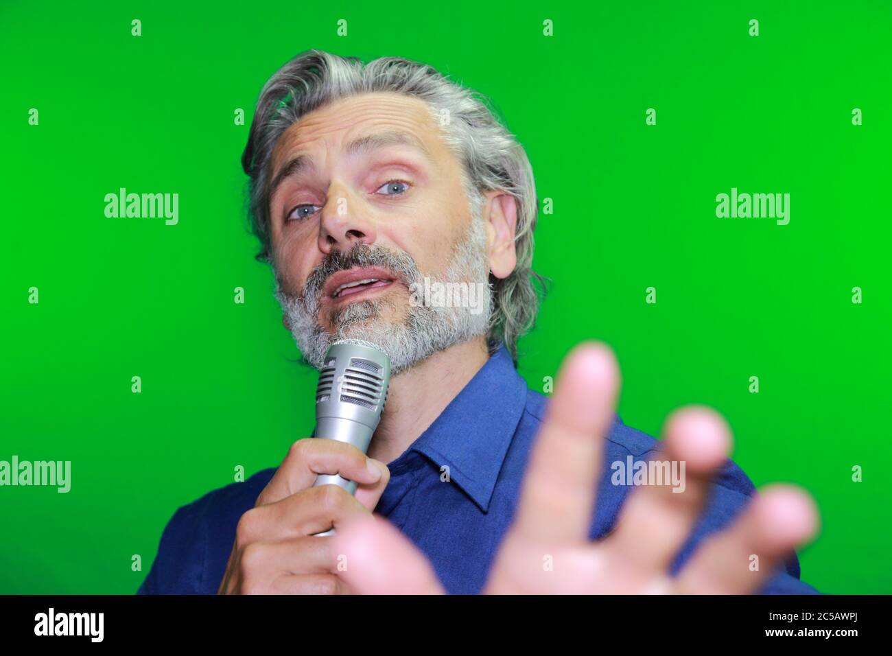 Handsome man over green hi-res stock photography and images - Alamy