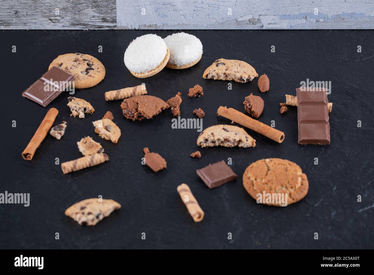 Chocolate and biscuits on the black table Stock Photo - Alamy