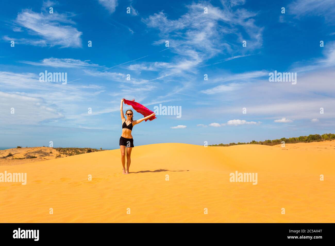 Beautiful caucasian girl having fun on Red sand dunes in Mui Ne, Phan ...