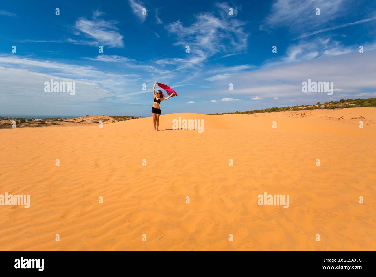 Beautiful caucasian girl having fun on Red sand dunes in Mui Ne, Phan ...