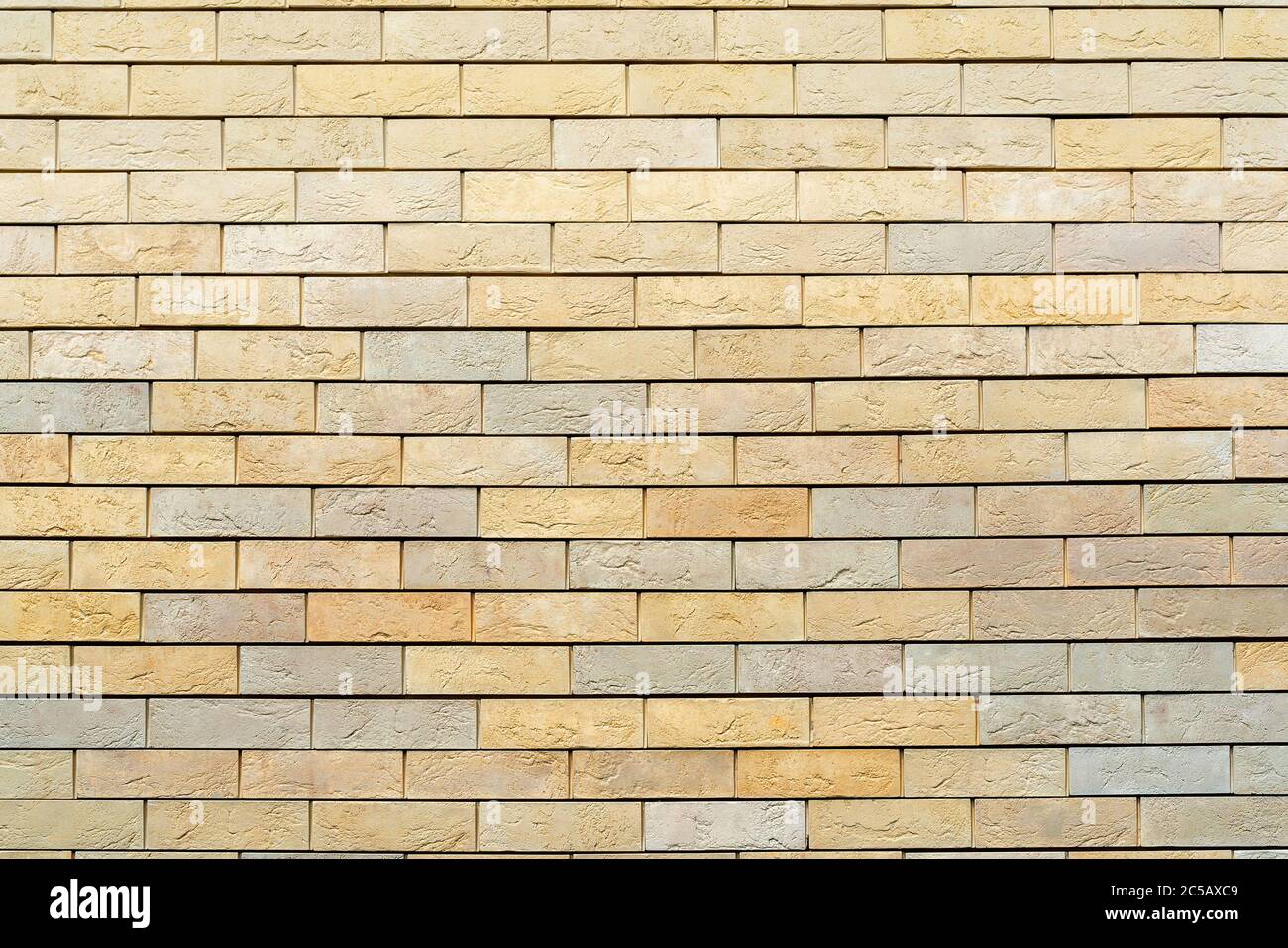Yellow brick wall. Facade of an old building. Architectural background ...