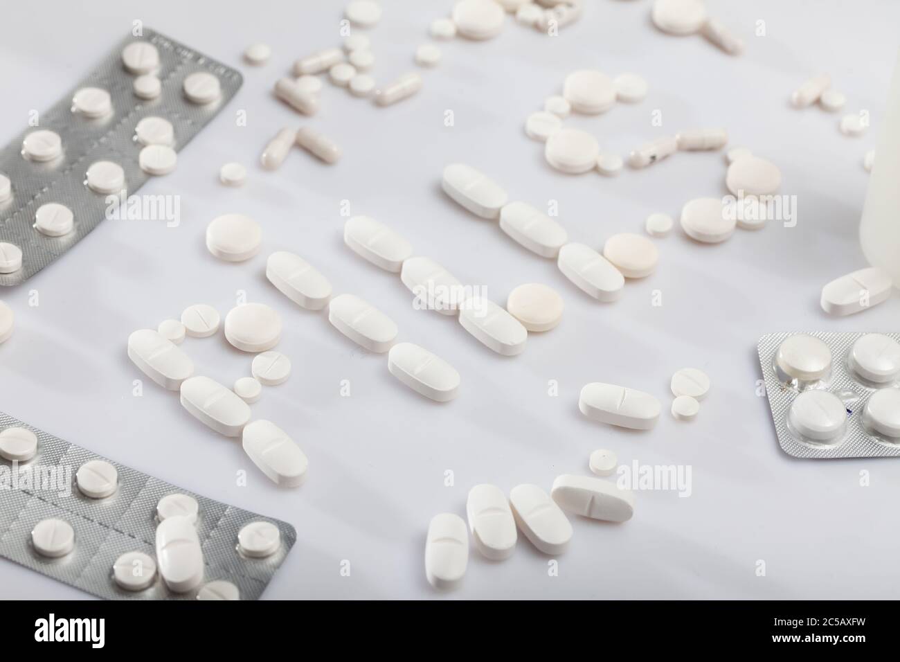 Various pills formed word PILLS on white background, medicine concept ...