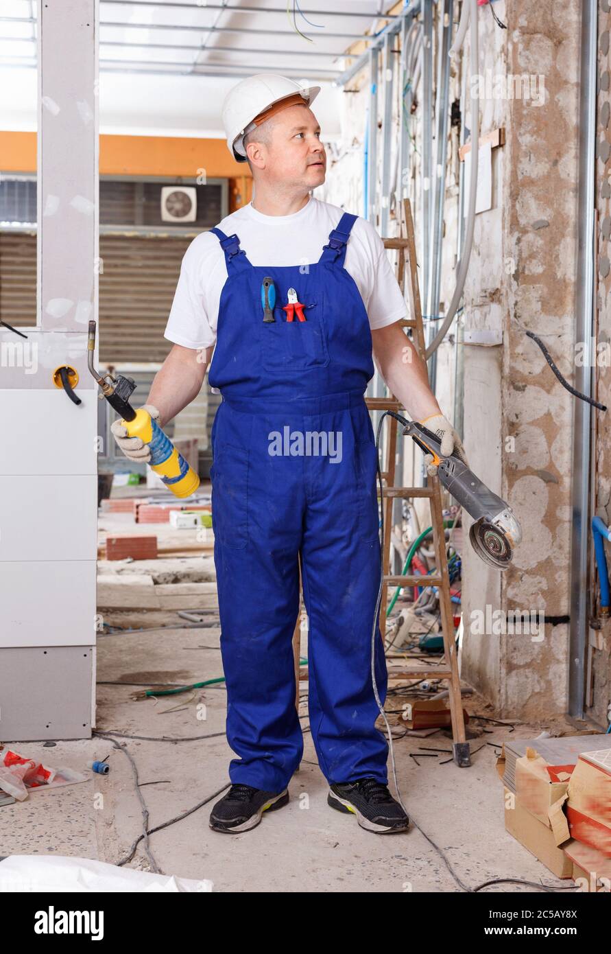 Confident diligent positive builder hi-res stock photography and images ...