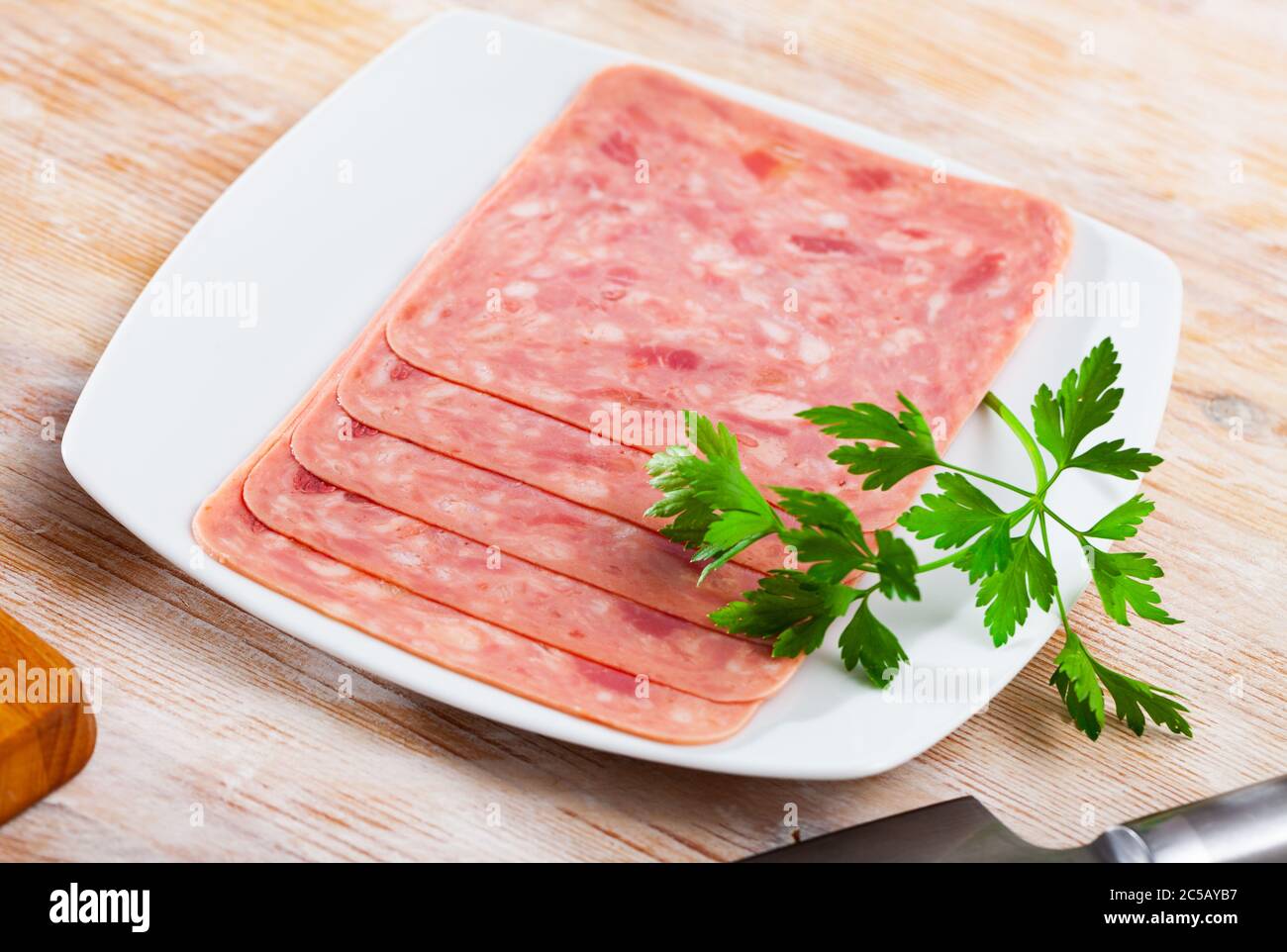 Image of slicing chopped ham from pork meat Stock Photo - Alamy
