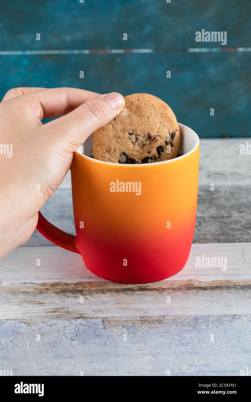 Dipping biscuit into tea hi-res stock photography and images - Alamy