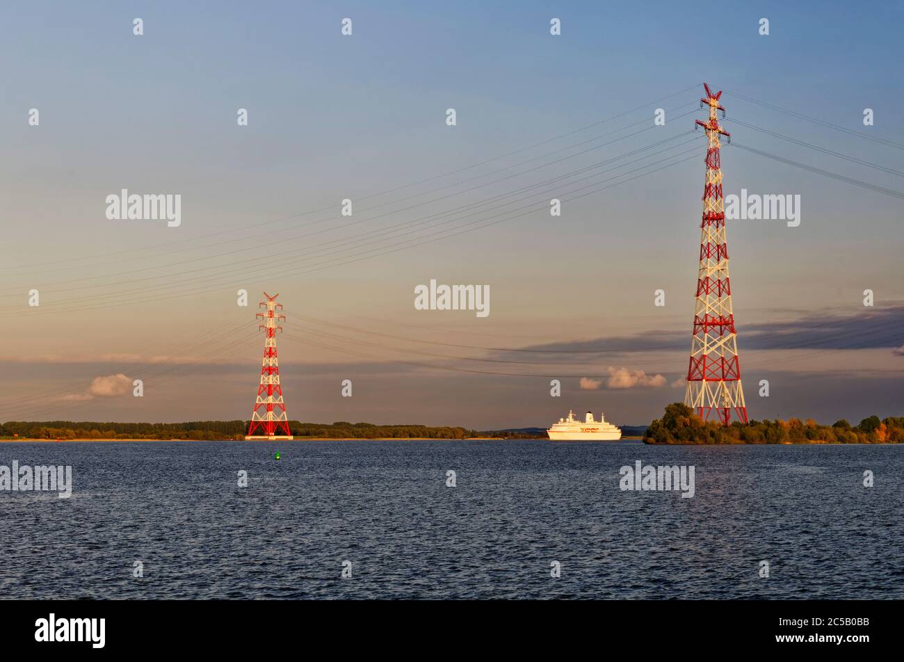 Elbe crossing 1:Two transmission towers on river Elbe, cruise ship ...