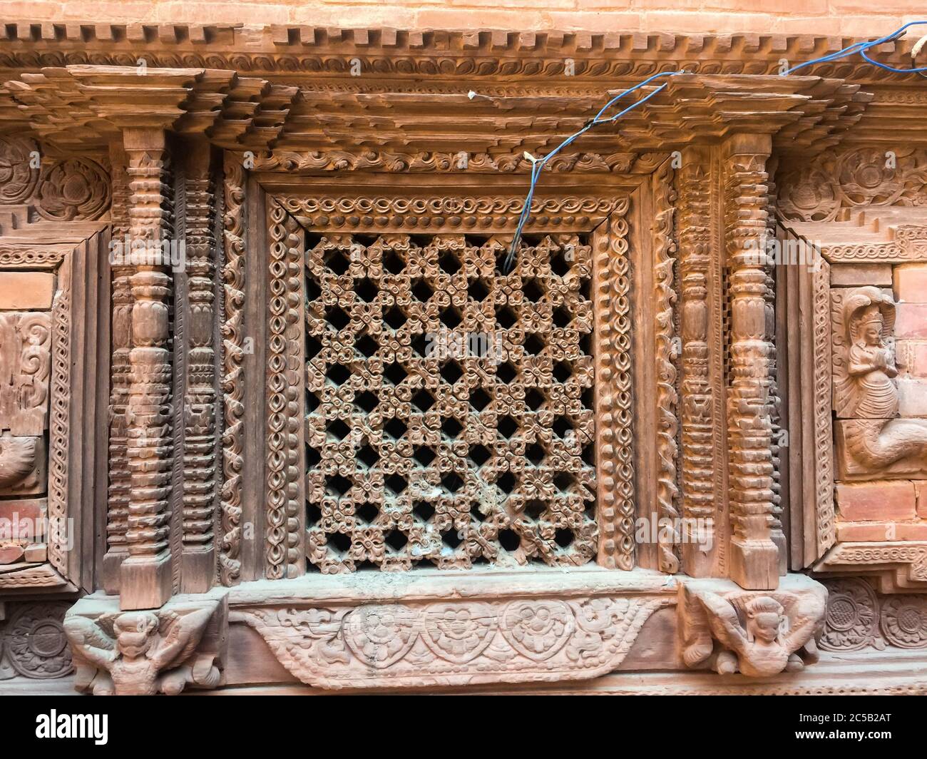 Beautiful shot of an old temple window with big holes Stock Photo - Alamy