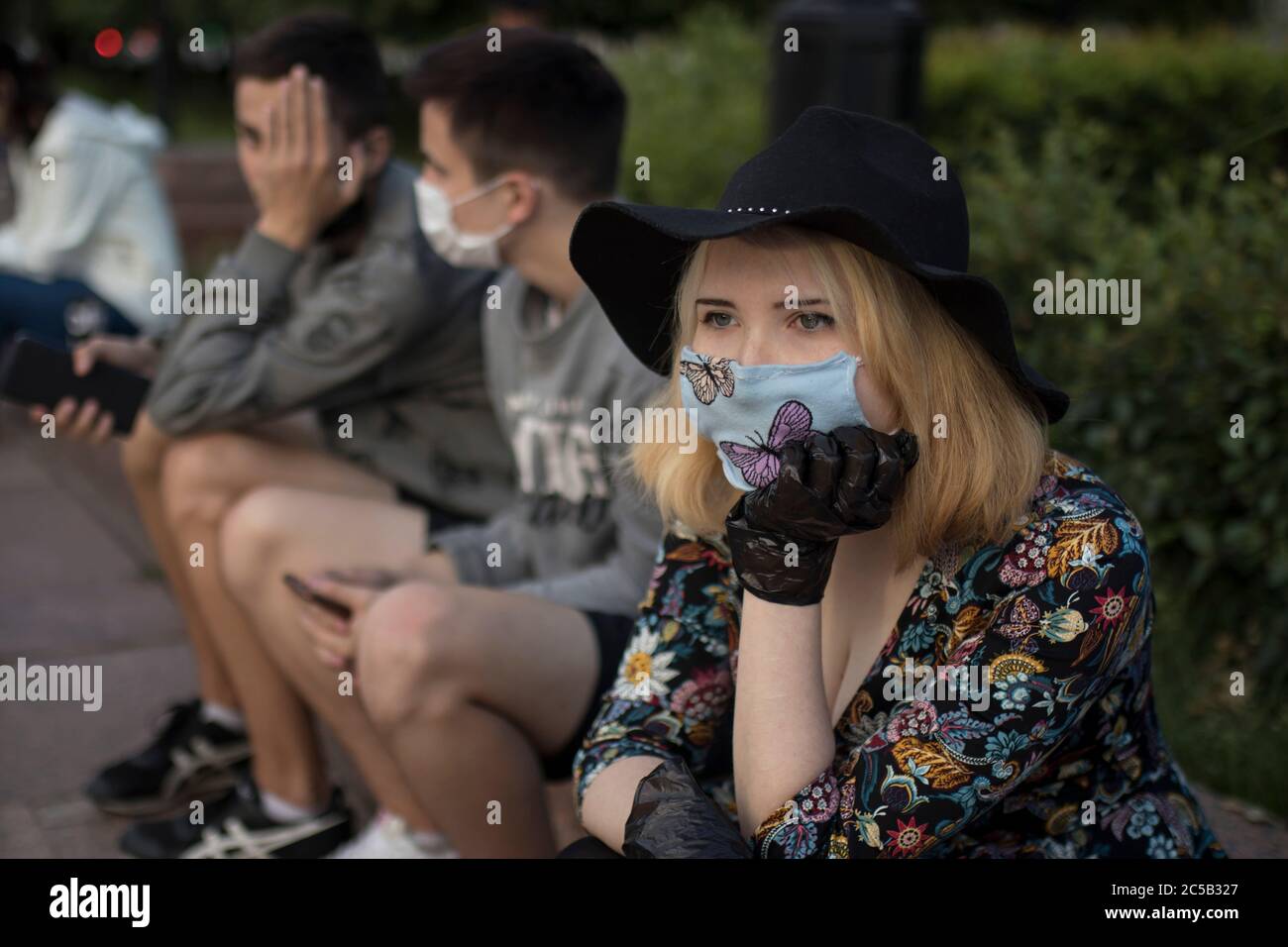 Moscow, Russia - 01 July 2020, The blonde girl in a medical mask with ...